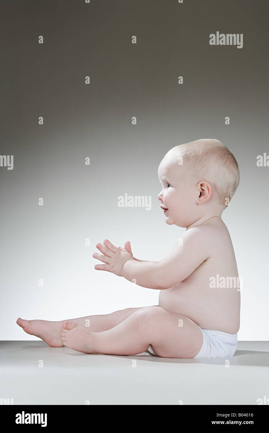 A baby boy clapping Stock Photo - Alamy