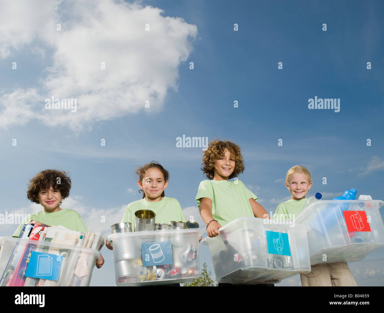 Children carrying boxes of recycling Stock Photo - Alamy