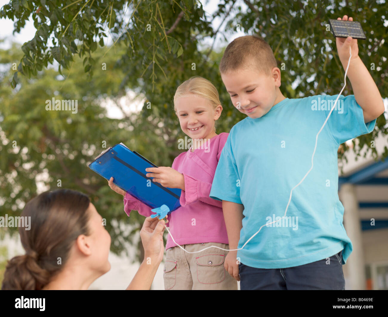 Children holding solar panels Stock Photo - Alamy