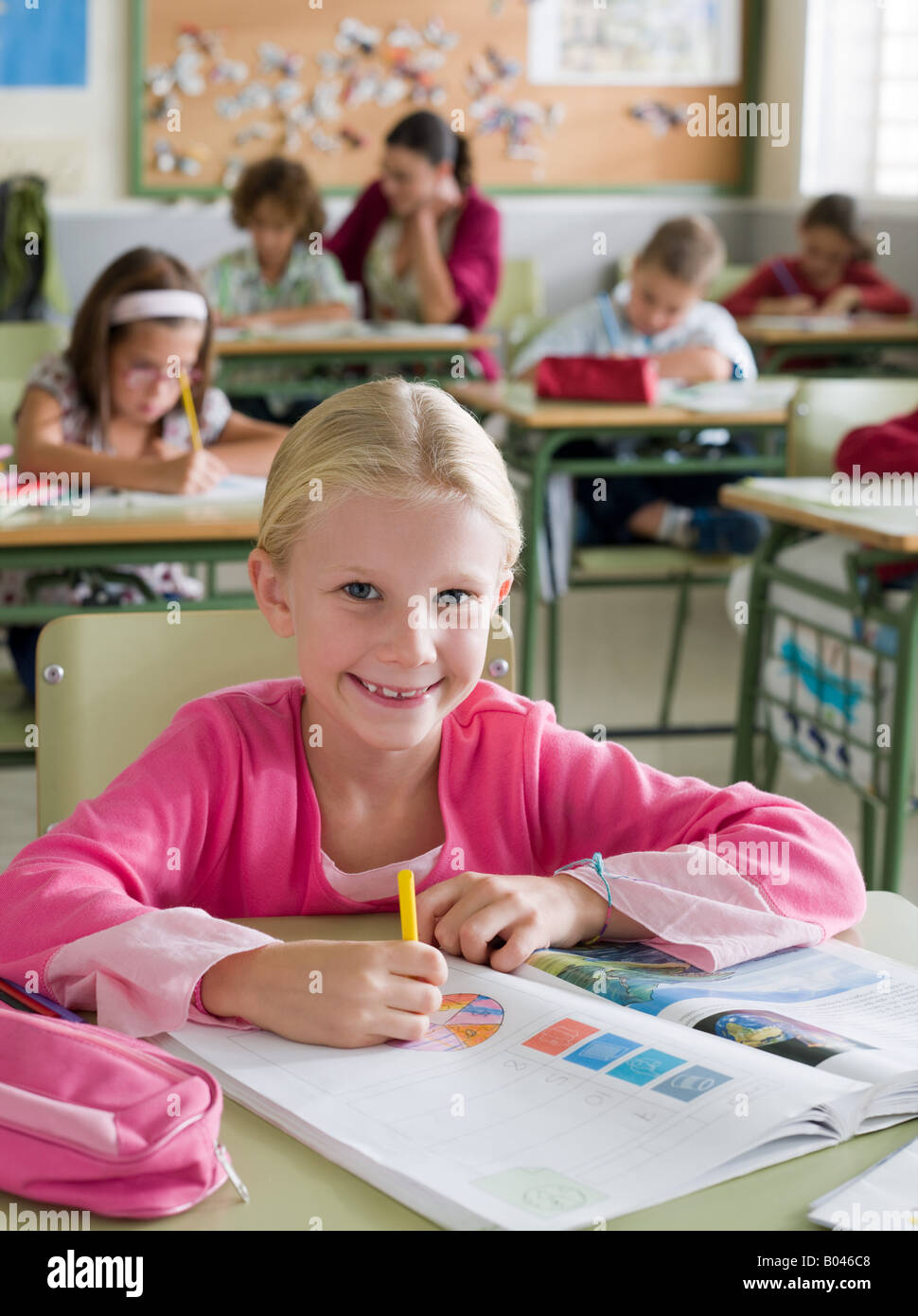 Girl in classroom Stock Photo - Alamy