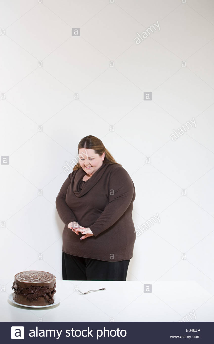 Overweight Woman Eating Cake Stock Photos & Overweight Woman Eating ...