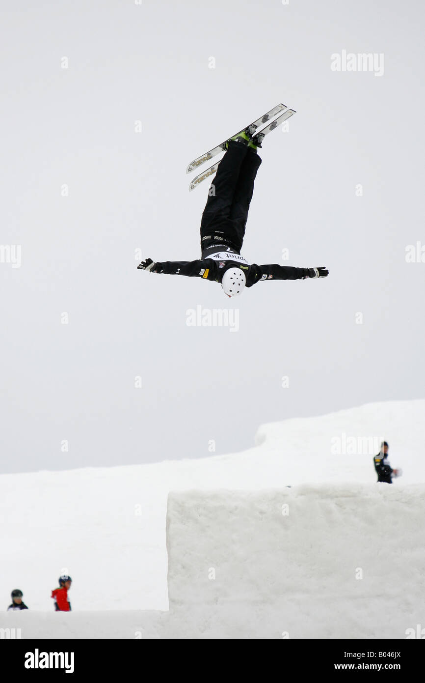 A freestyle skier upside down over the jump Stock Photo - Alamy