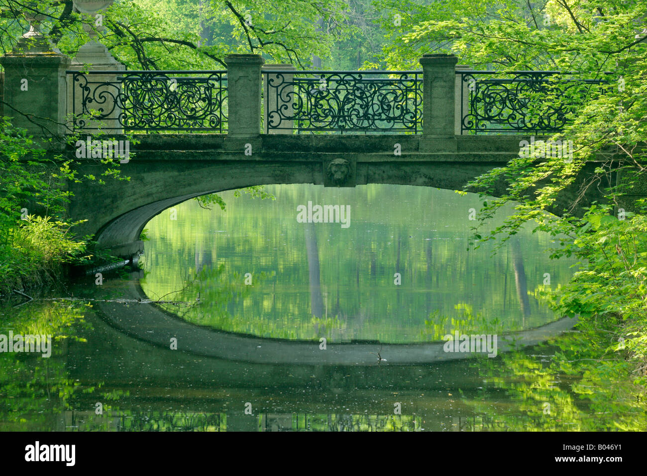 Romantic bridge in baroque style built bridge reflecting in brook in ...