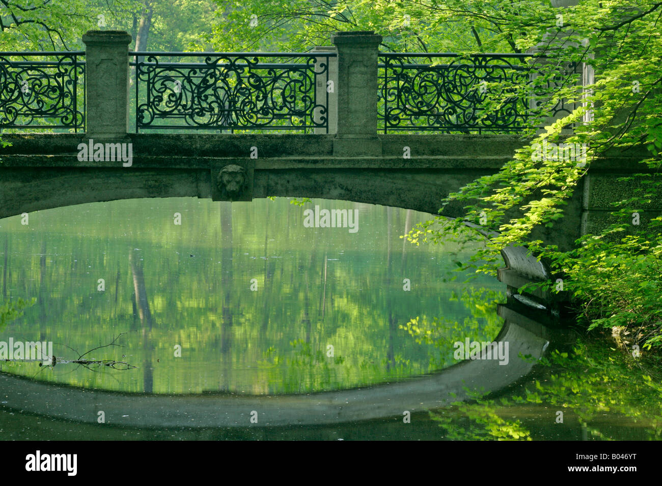 Romantic bridge in baroque style built bridge reflecting in brook in ...