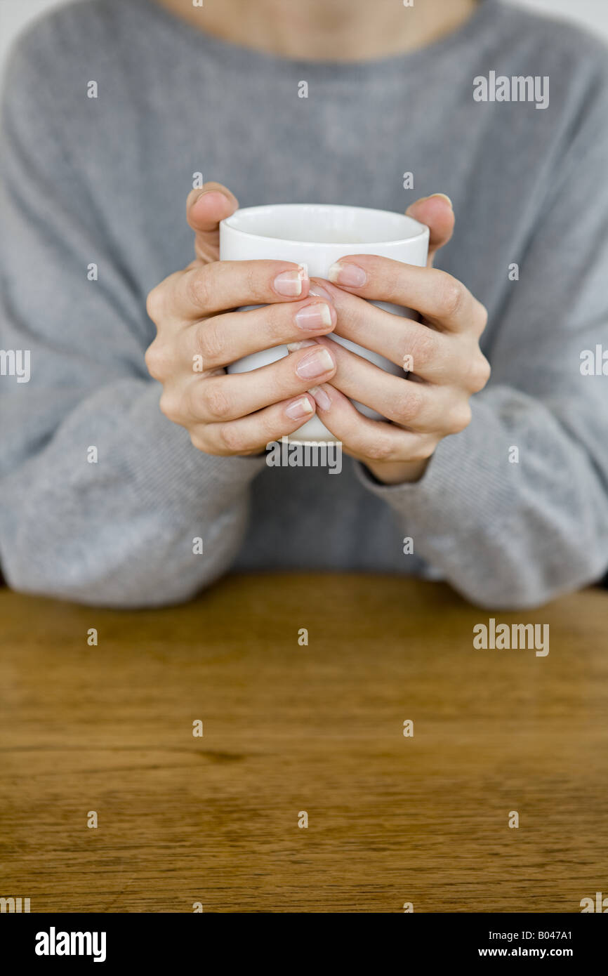 Woman with a cup Stock Photo - Alamy
