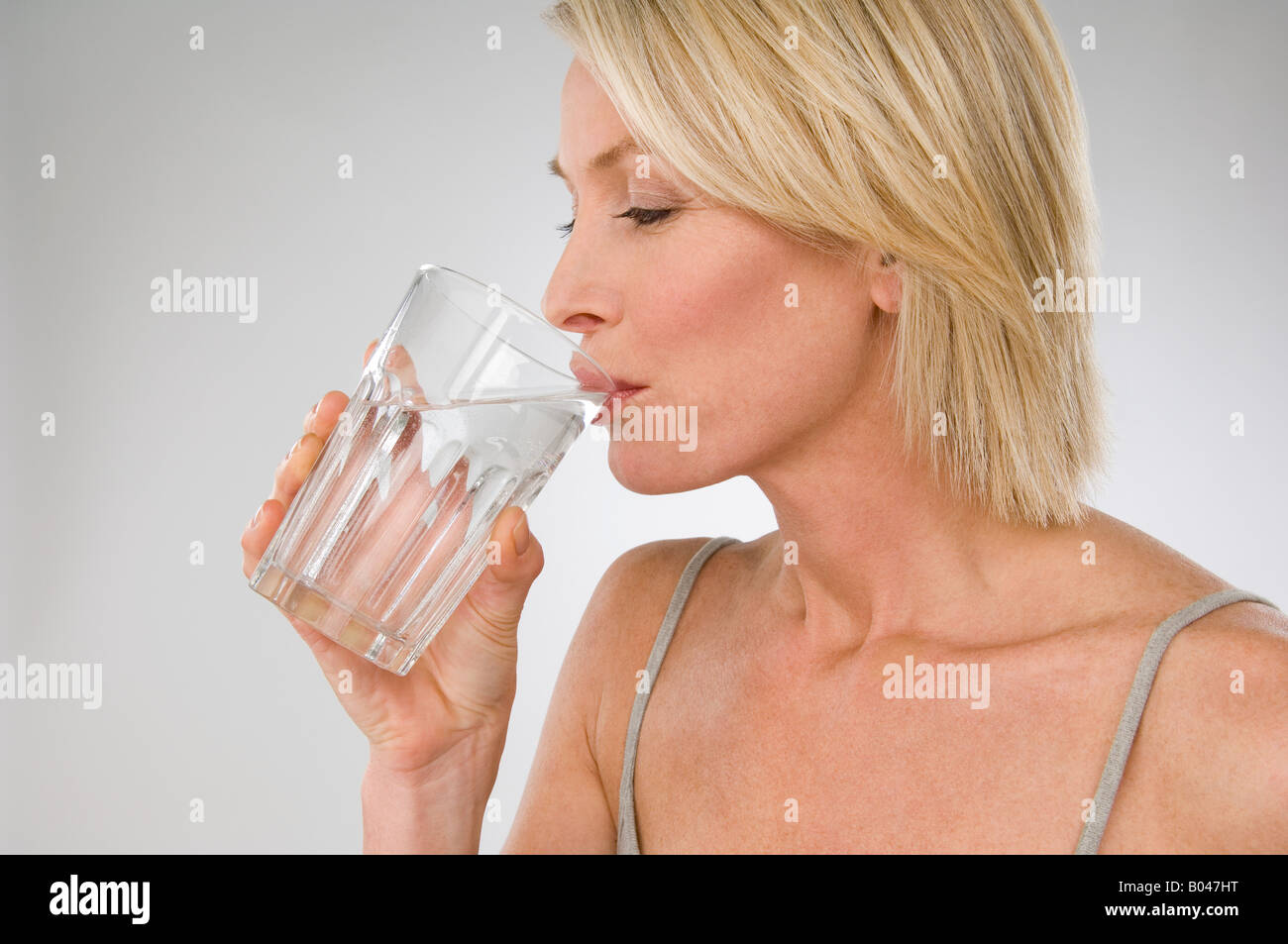 A woman drinking water Stock Photo - Alamy