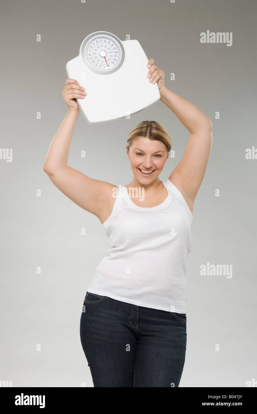 Fat woman and scales hi-res stock photography and images - Alamy
