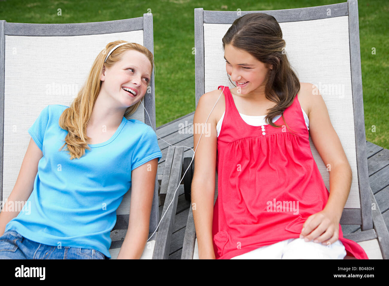 Teenage girls listening to music Stock Photo - Alamy