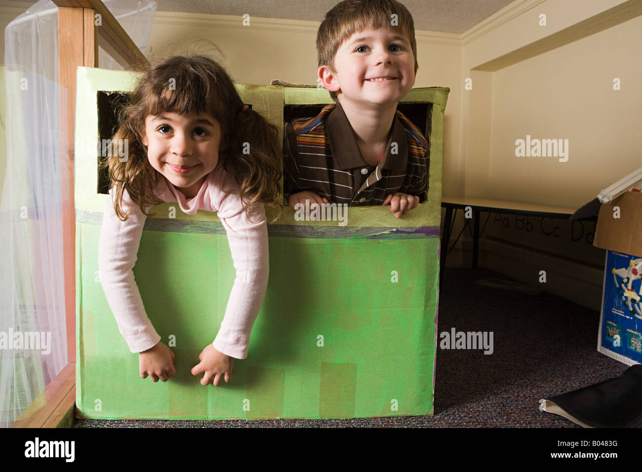 Children playing in a box Stock Photo - Alamy