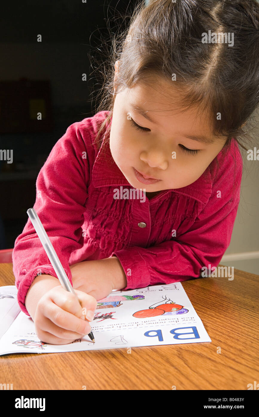 A girl writing Stock Photo - Alamy