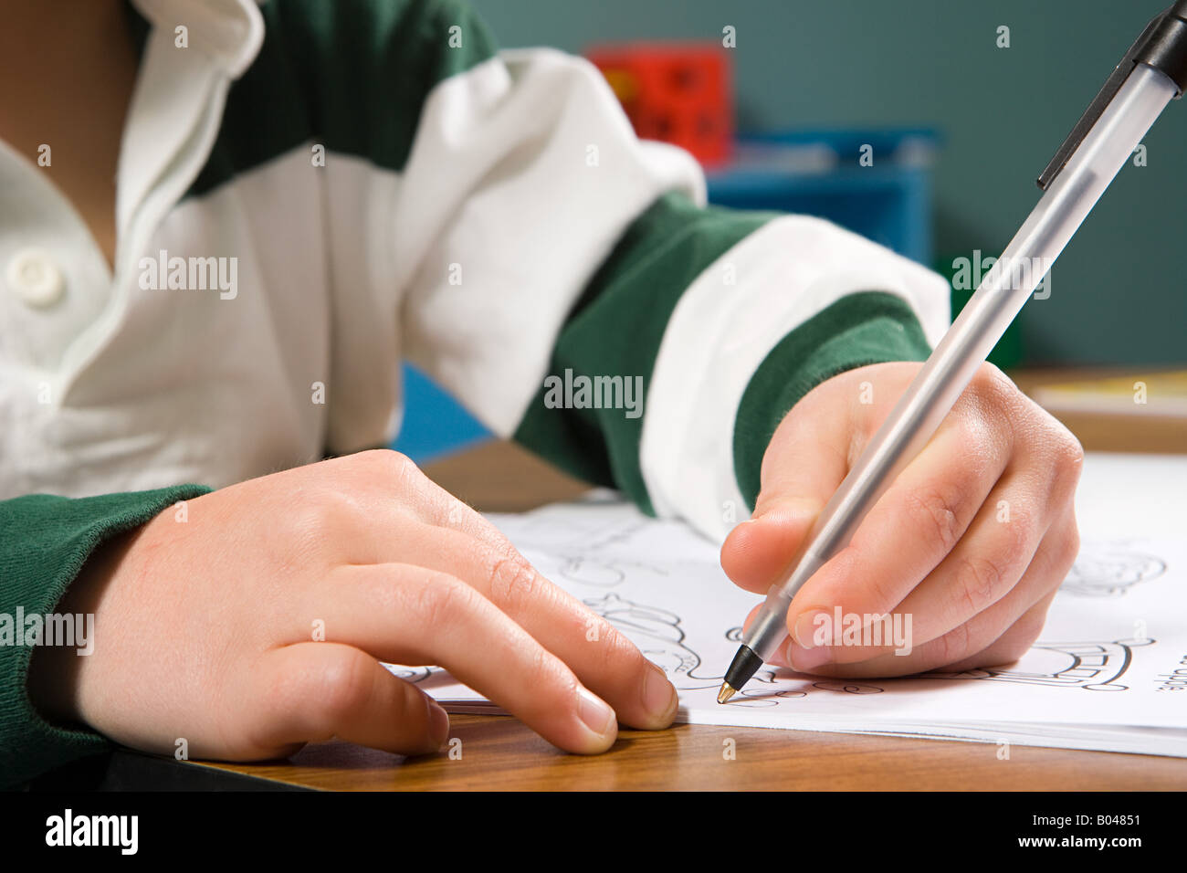 A boy writing Stock Photo - Alamy