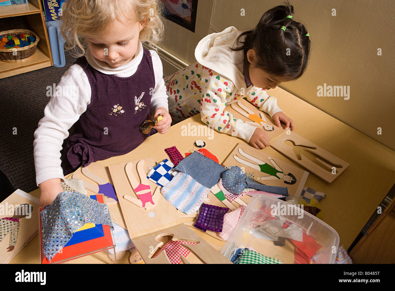Girls in a craft lesson Stock Photo - Alamy