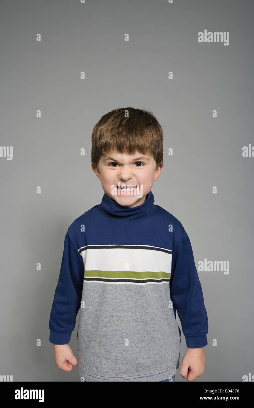 Portrait of an angry boy Stock Photo - Alamy