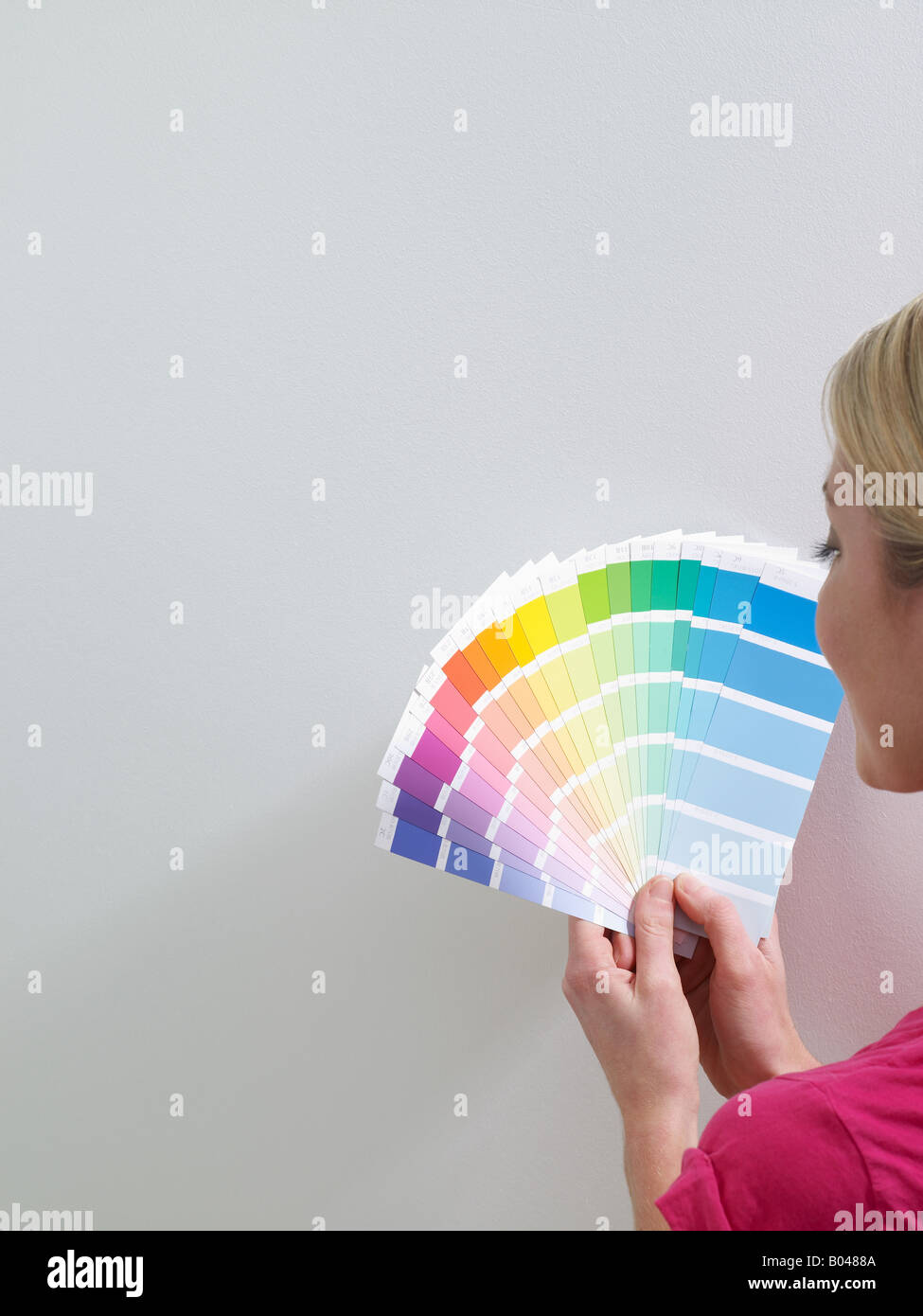 A woman looking at colour charts Stock Photo - Alamy