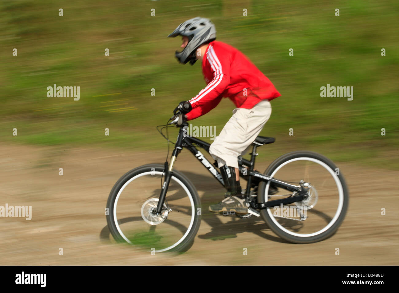 young boy with his mountain bike taking part in a race Stock Photo - Alamy