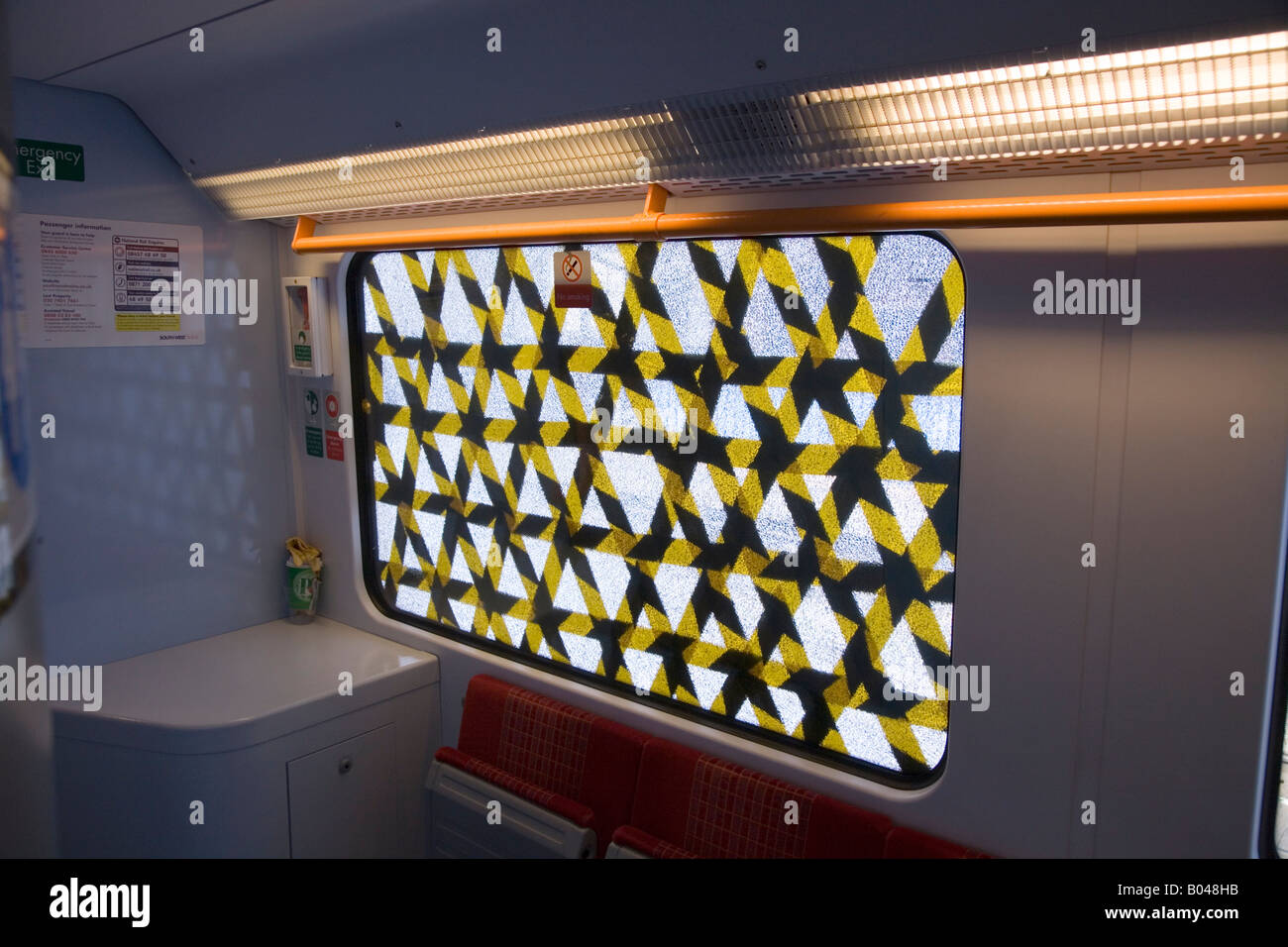 Temporary repair - with tape ­ to a smashed window on a South West ...