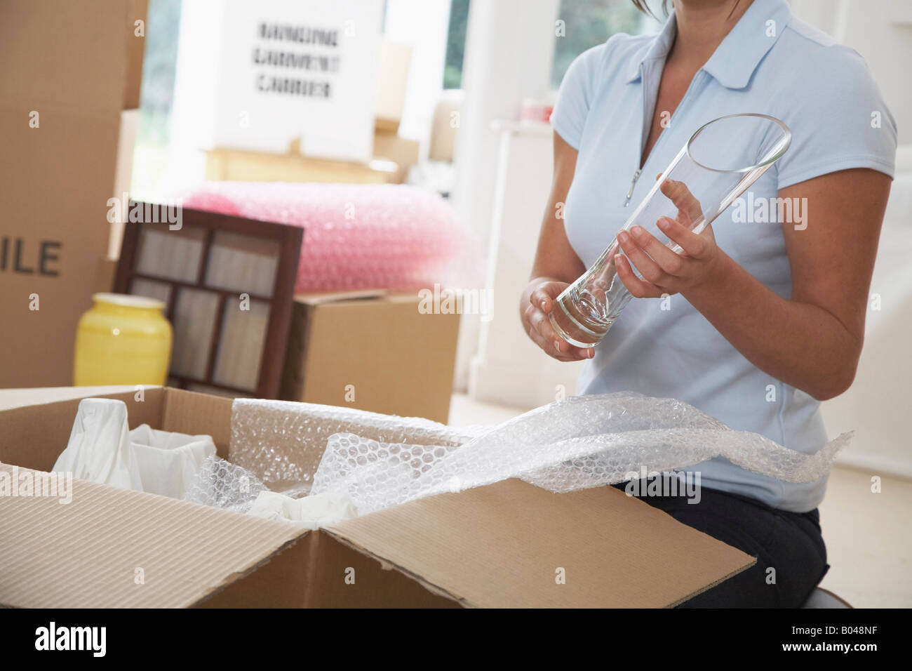 Woman Packing Boxes Stock Photo - Alamy