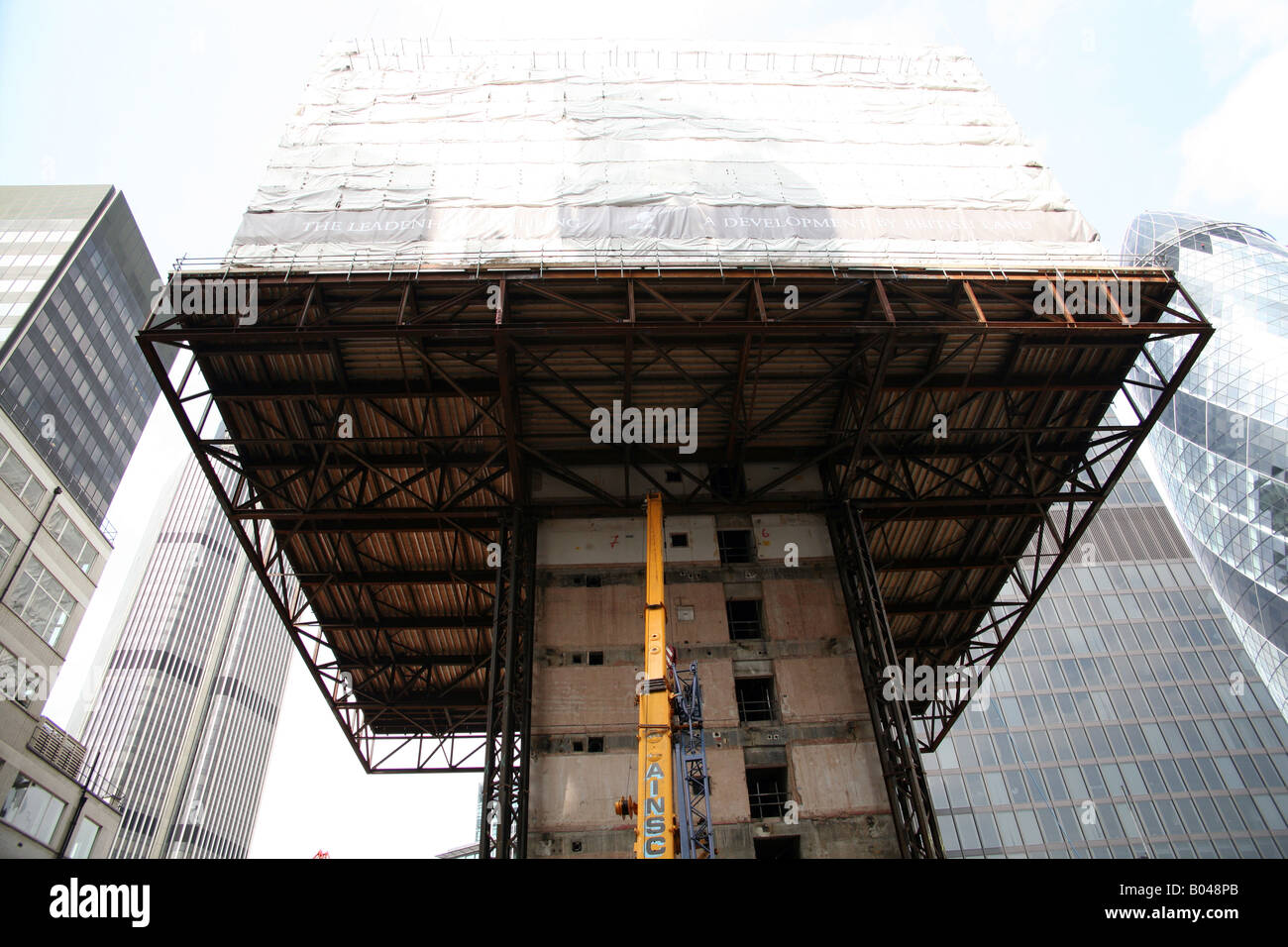 Building in City of London being demolished from bottom up Stock Photo ...