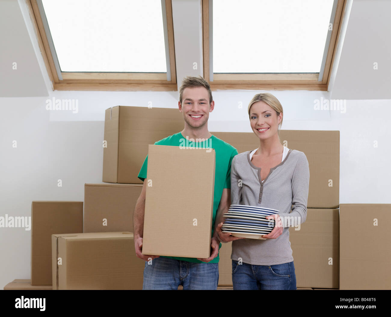 Portrait of a couple in their new home Stock Photo - Alamy