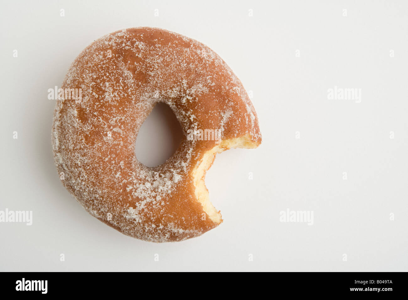 Doughnut with missing bite Stock Photo - Alamy