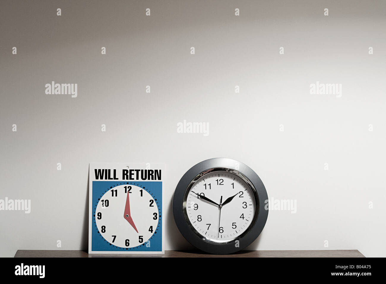 Sign and clock Stock Photo - Alamy