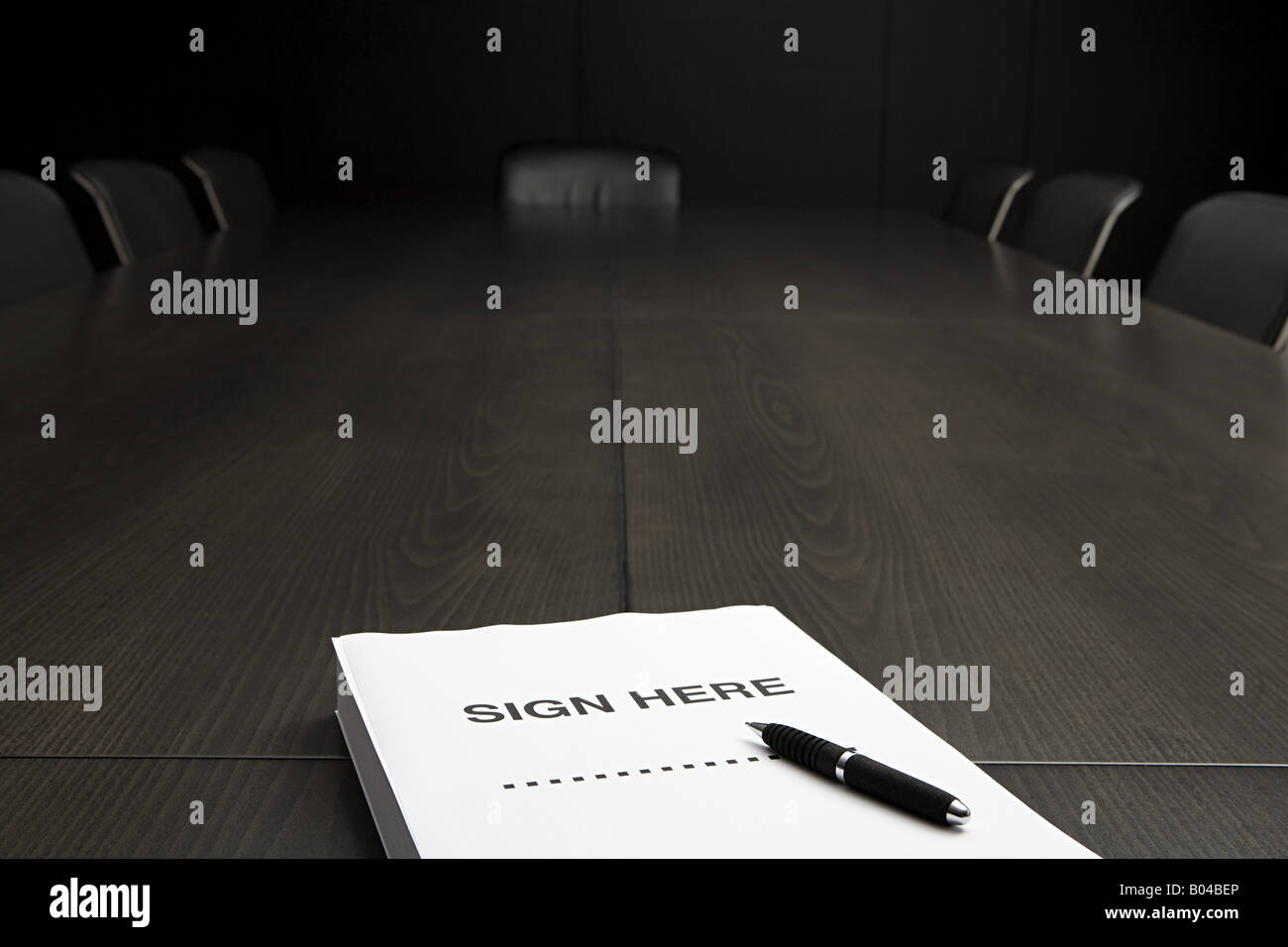 Contract on a conference table Stock Photo - Alamy