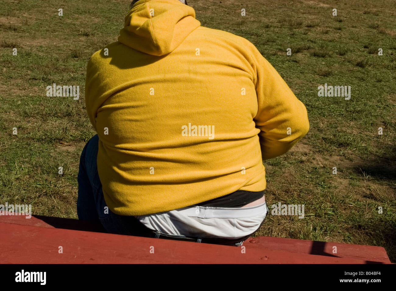 Fat man sitting on bench hi-res stock photography and images - Alamy