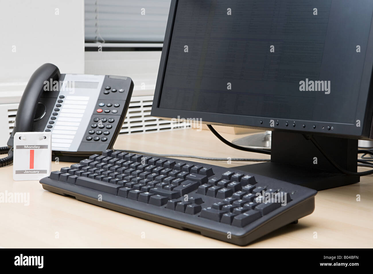 Computer and telephone in office Stock Photo - Alamy