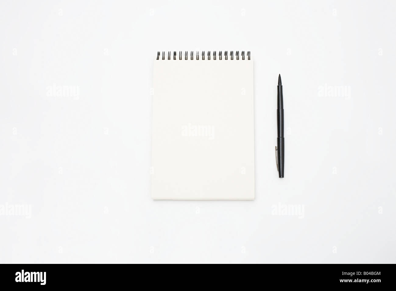 Notepad and pen Stock Photo - Alamy