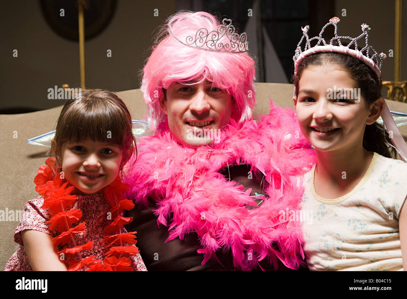 A father and his daughters playing fancy dress Stock Photo - Alamy