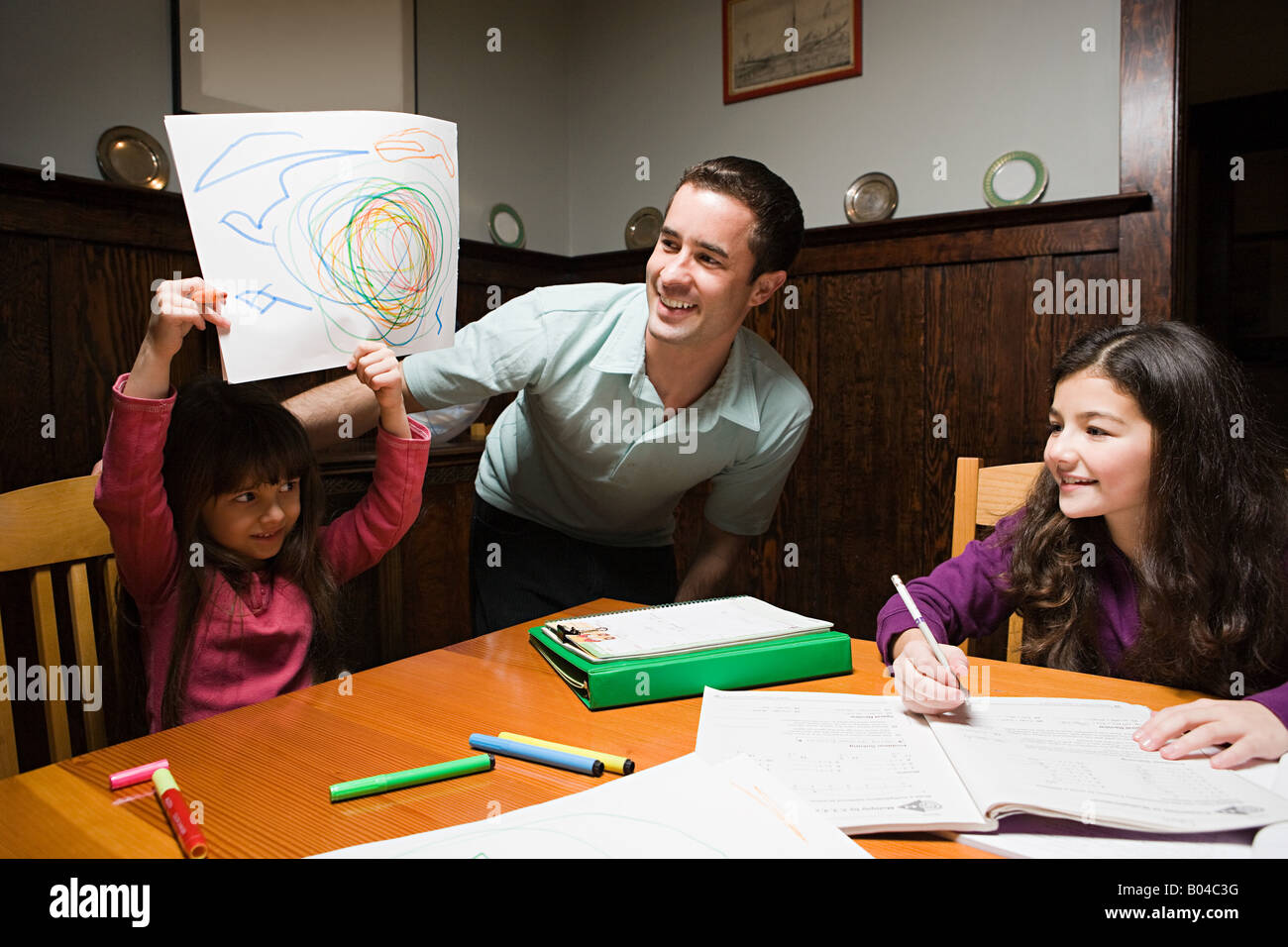 Parent supervising homework hi-res stock photography and images - Alamy