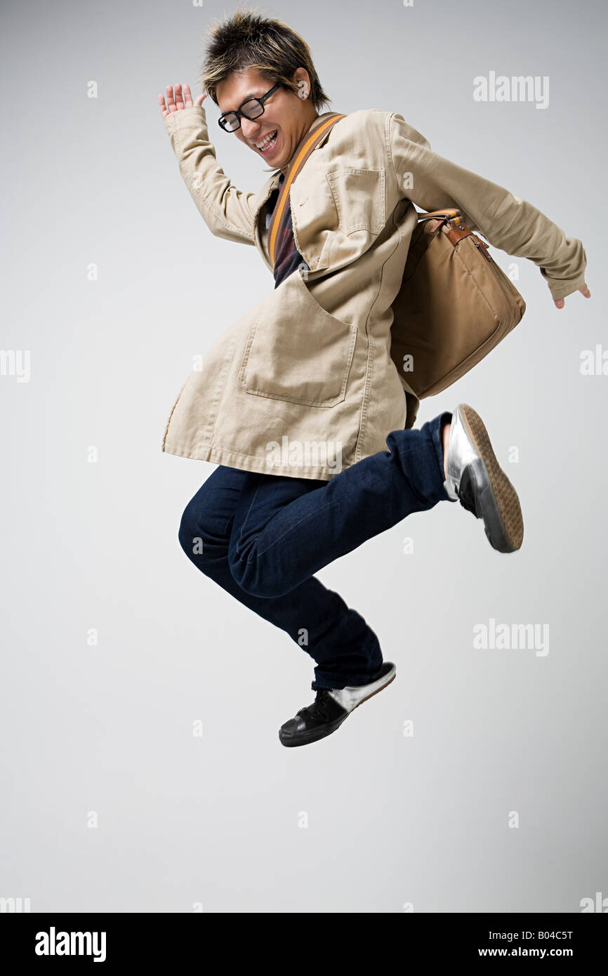 Japanese man jumping for joy Stock Photo - Alamy