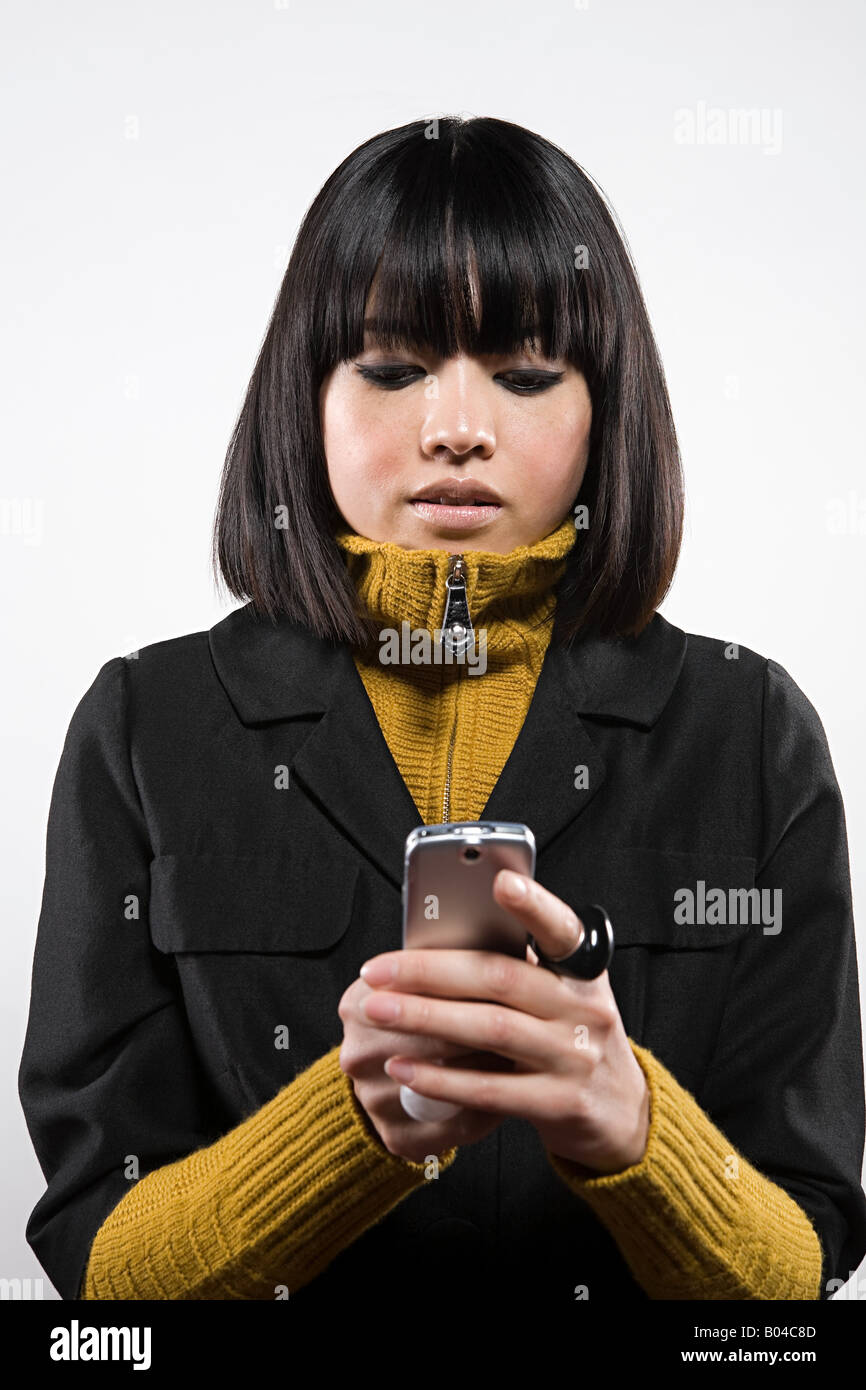 Young woman text messaging Stock Photo - Alamy