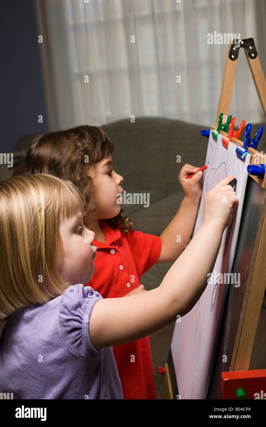 Two girls drawing Stock Photo - Alamy