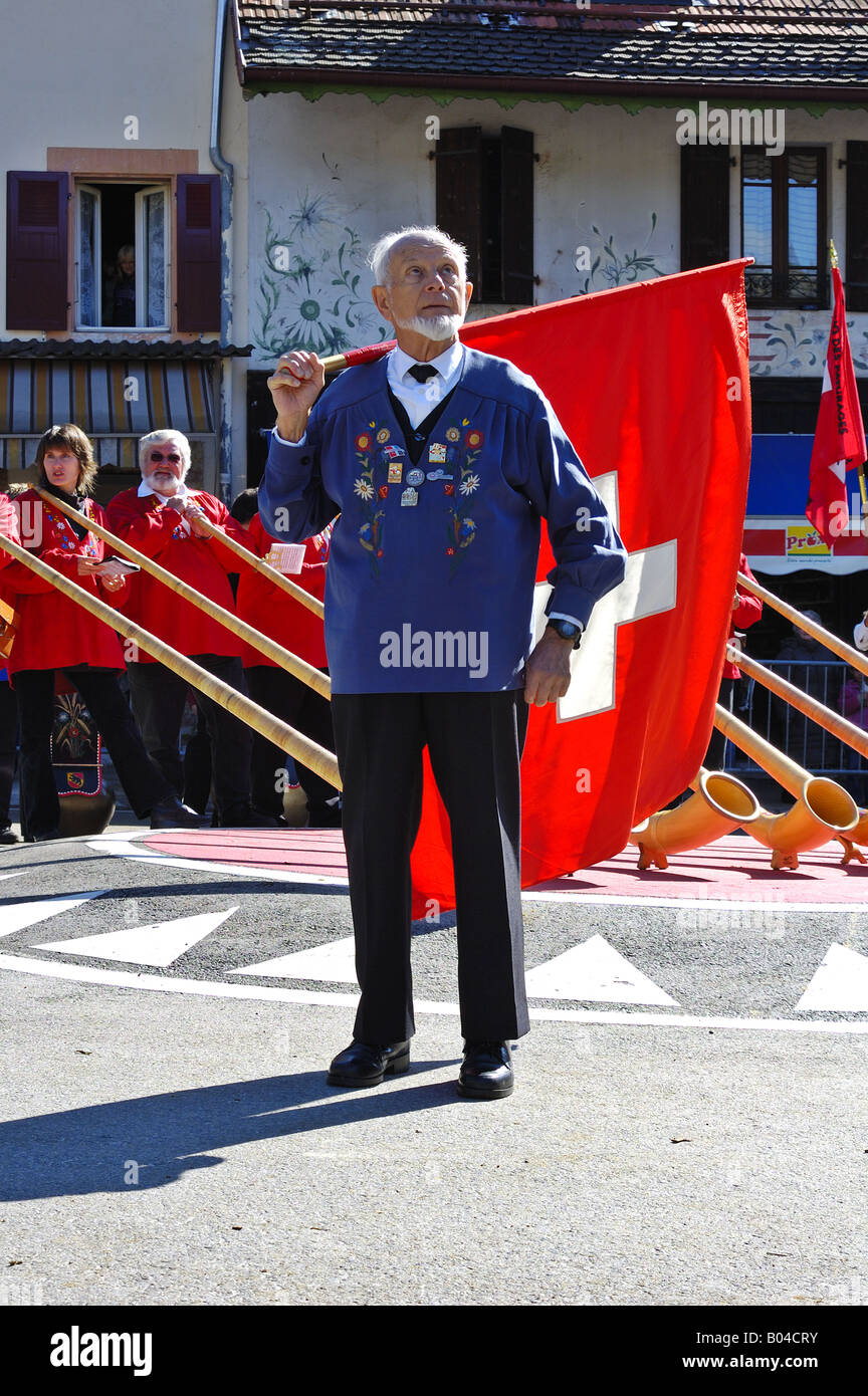 A Swiss flag-thrower performing in the town of St Cergue, at their ...