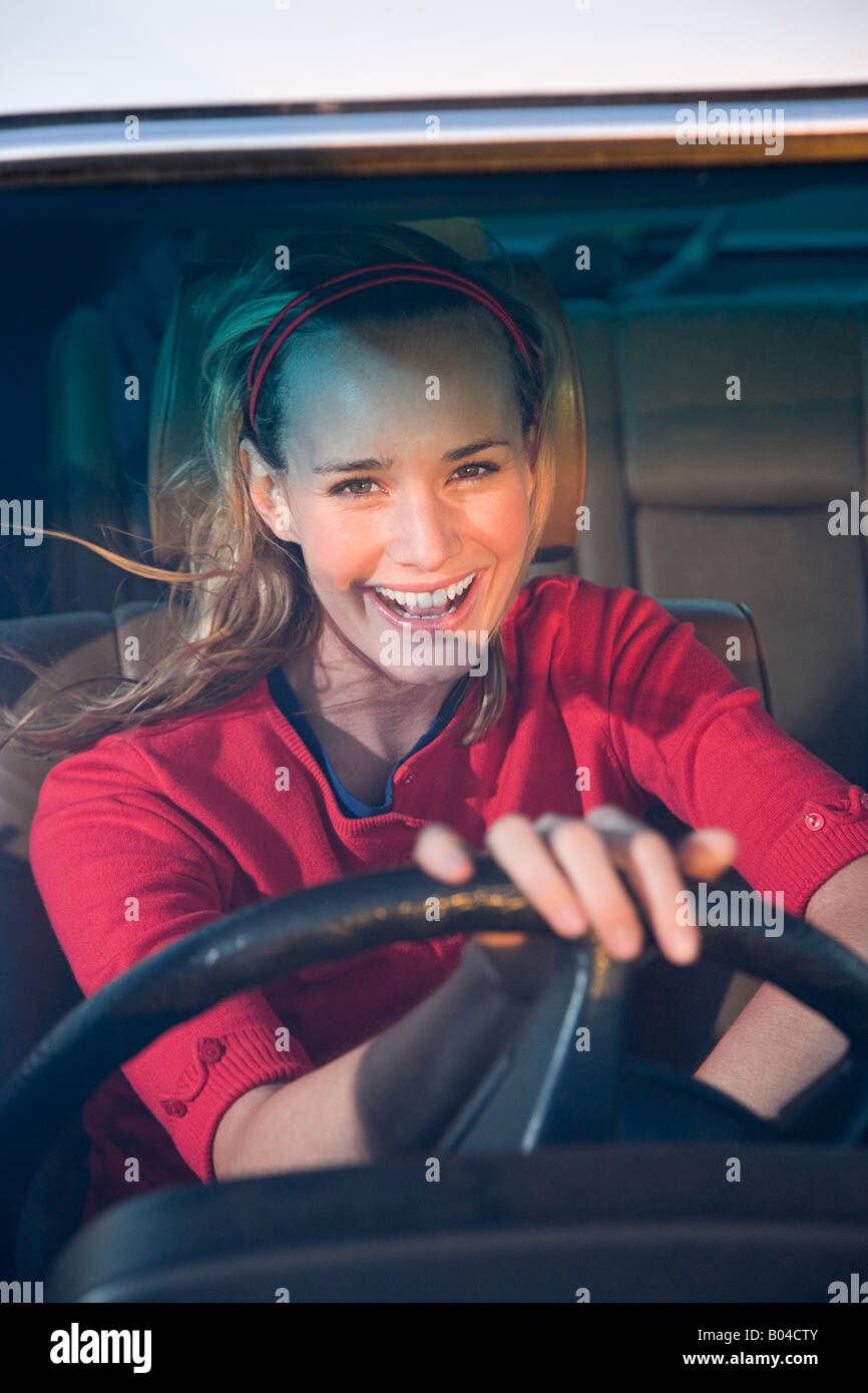 Young woman driving Stock Photo - Alamy