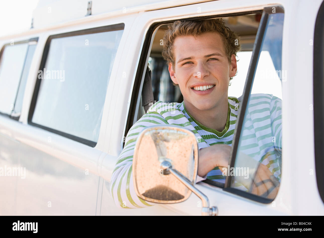 A young man in a camper van Stock Photo - Alamy