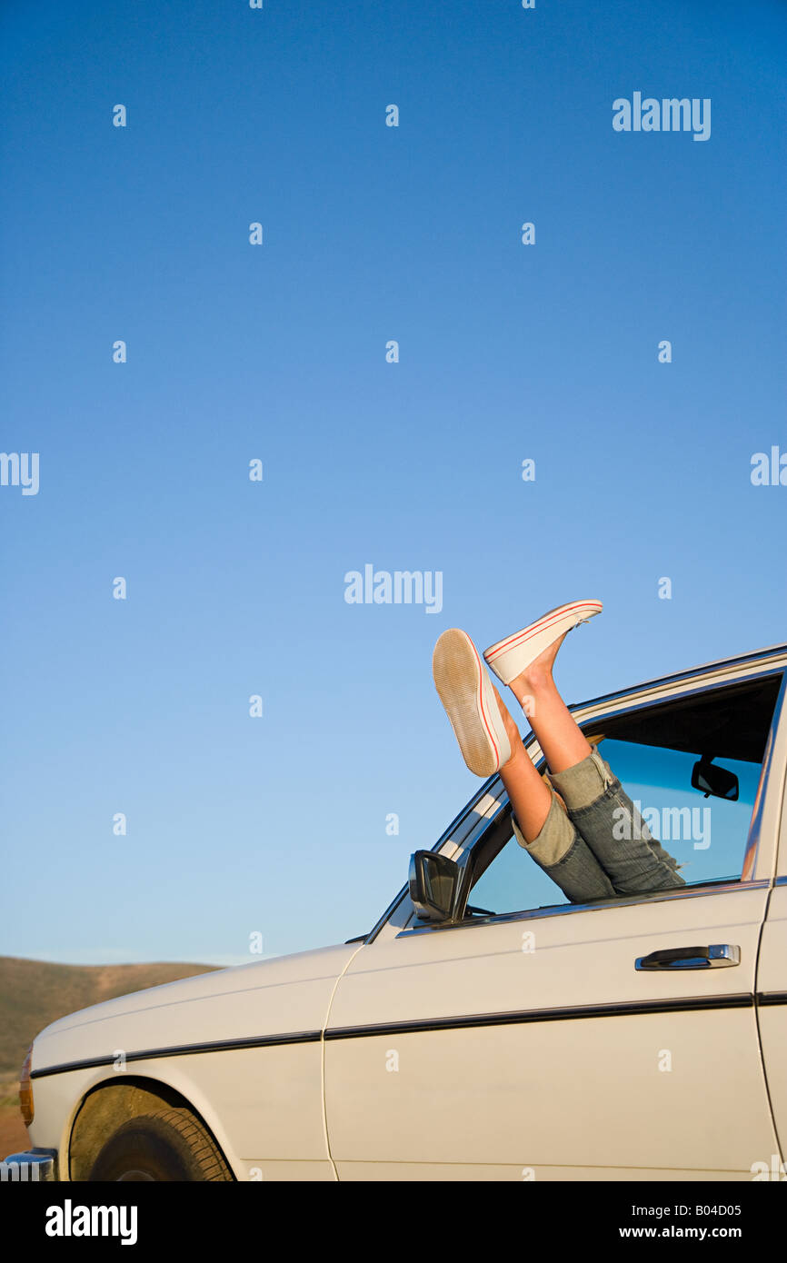 Young feet sticking out car hi-res stock photography and images - Alamy