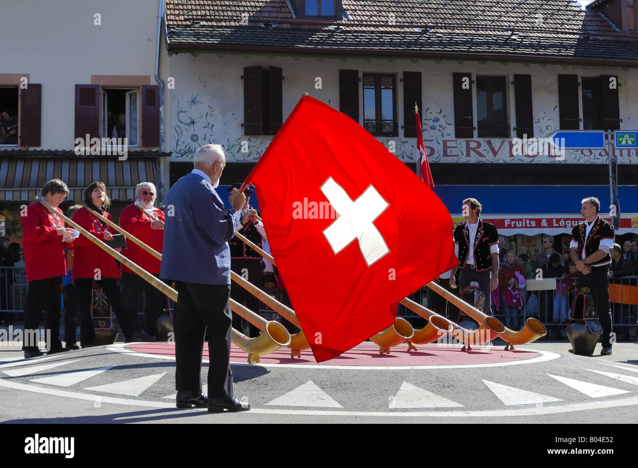 A Swiss flag-thrower performing in the town of St Cergue, at their ...