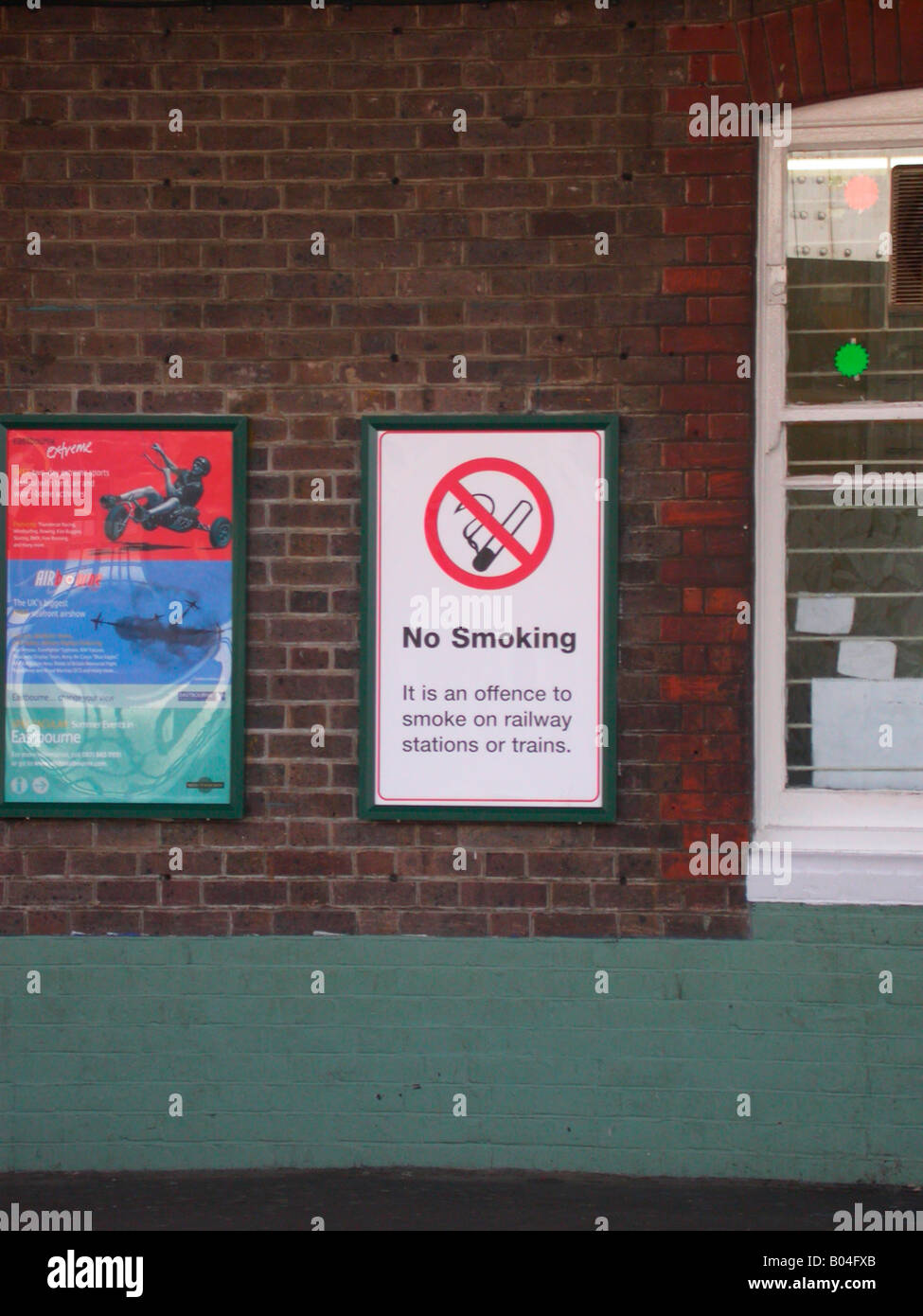 No Smoking sign on a railway station relating to both trains stations ...