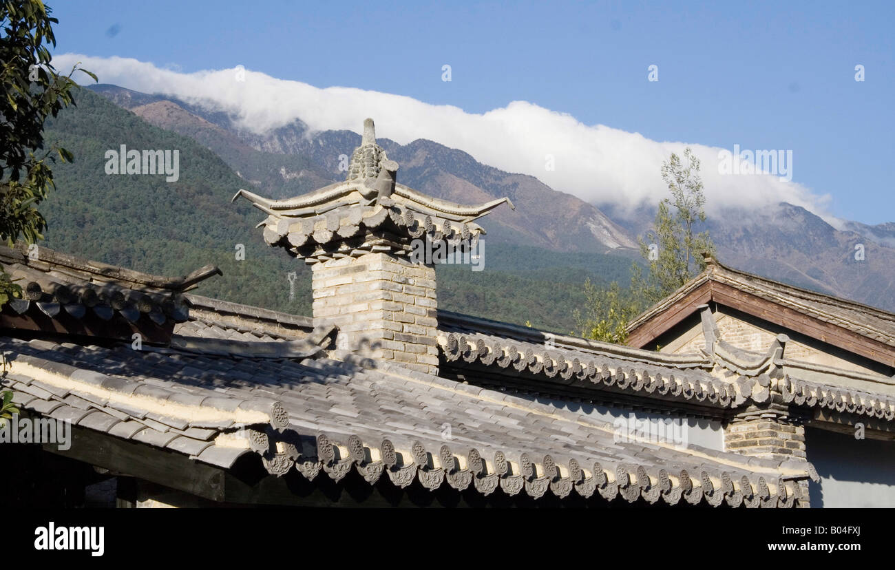 Ancient architectural roof top with Mt Cangshan as the backdrop, at ...