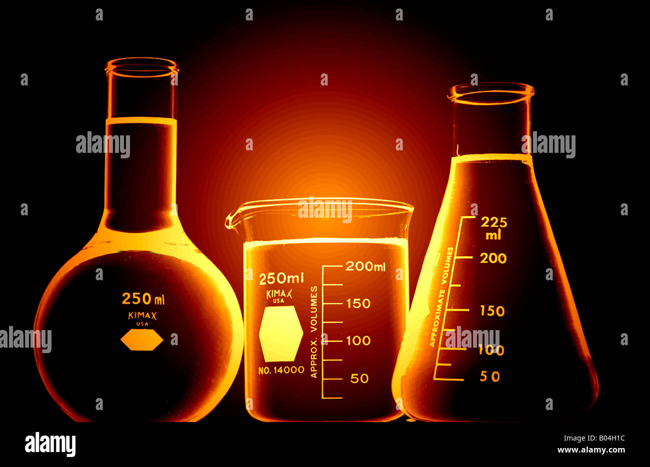 laboratory beakers of clear liquid in golden glow tone Stock Photo - Alamy