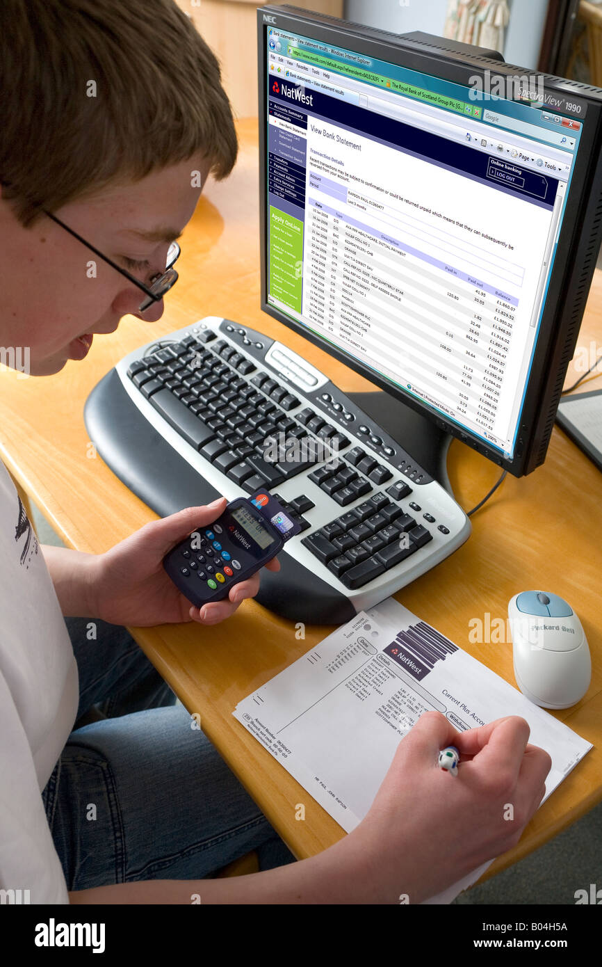 On-line banking card security and bank statement checking Stock Photo ...