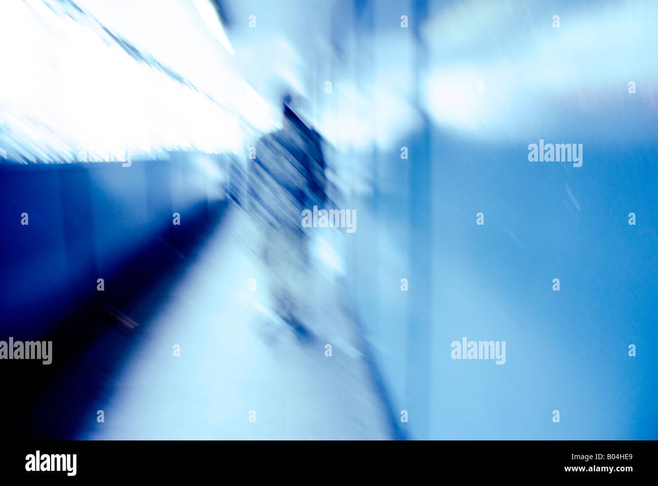 Blurred man walking Stock Photo - Alamy