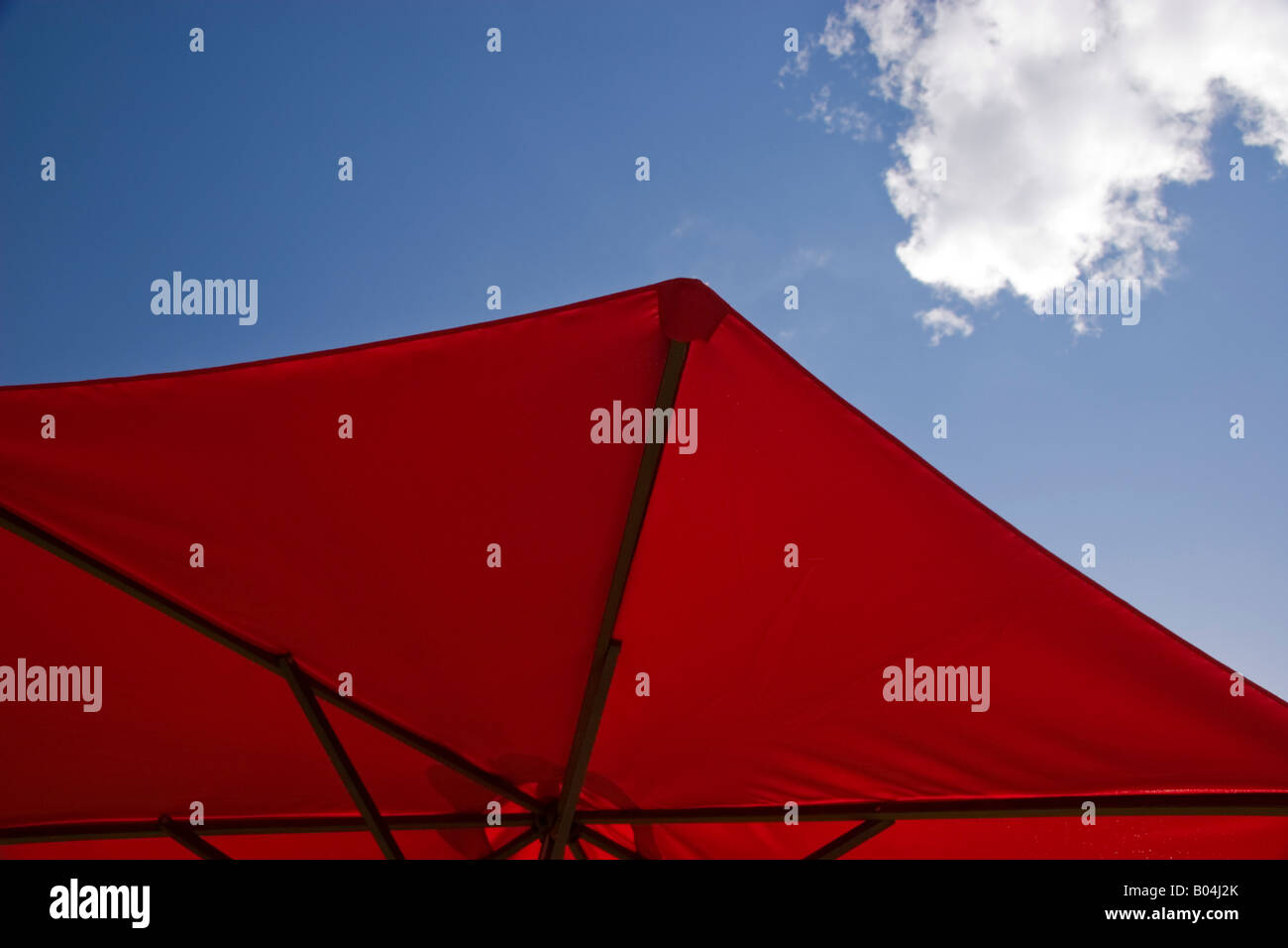 Parasol against blue sky Stock Photo - Alamy