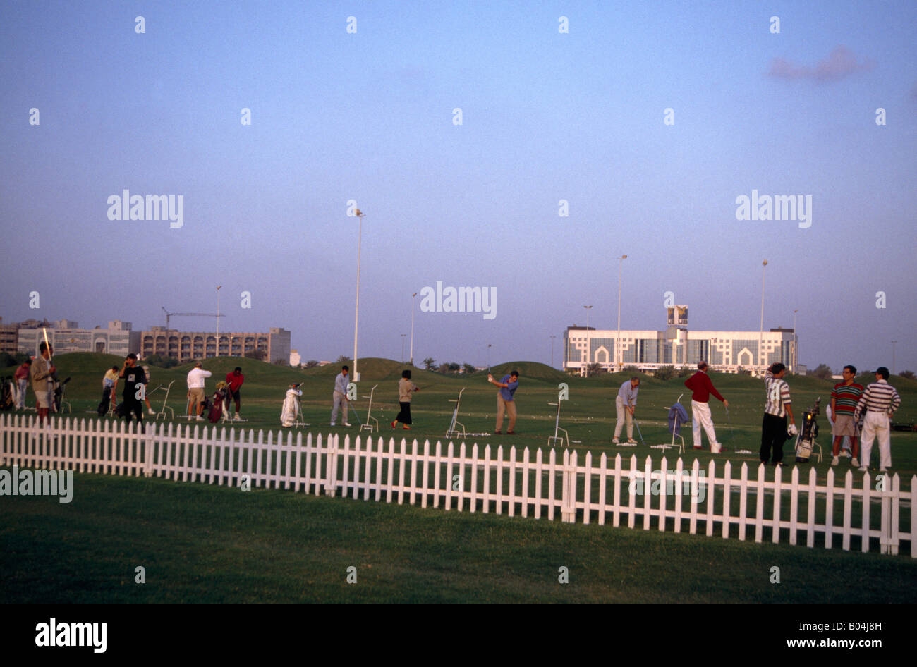 Dubai UAE Creek Golf Club People On Driving Range Stock Photo - Alamy