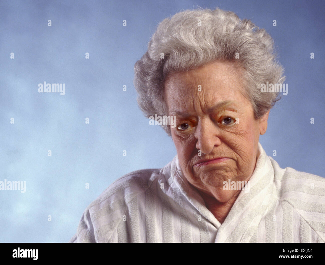 distraught elderly woman looking at camera Stock Photo - Alamy
