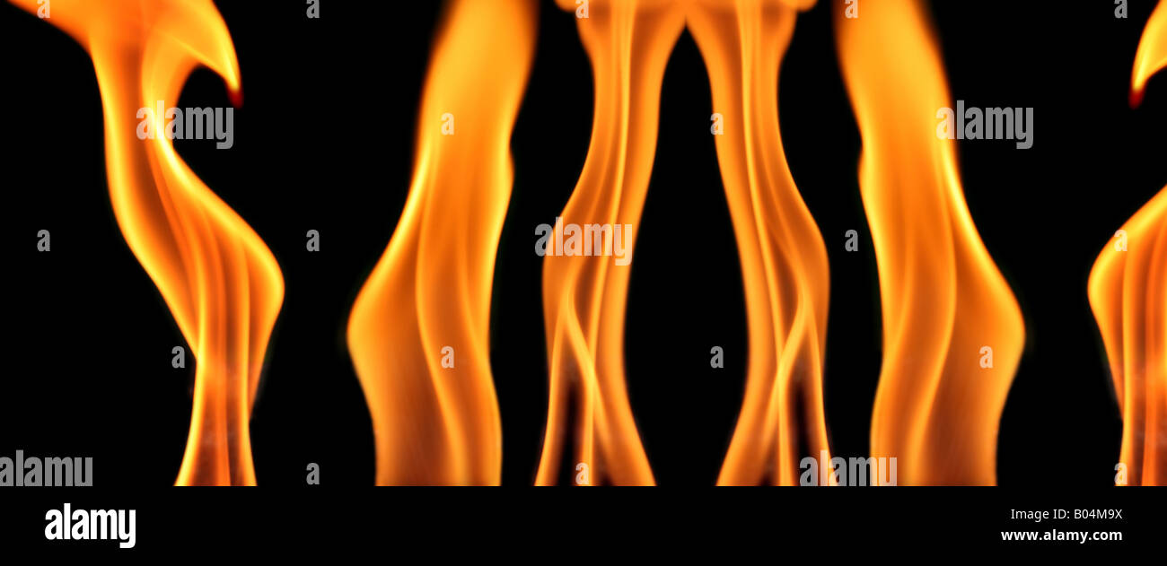 several gas flame burning on a dark background shot on the same flame ...