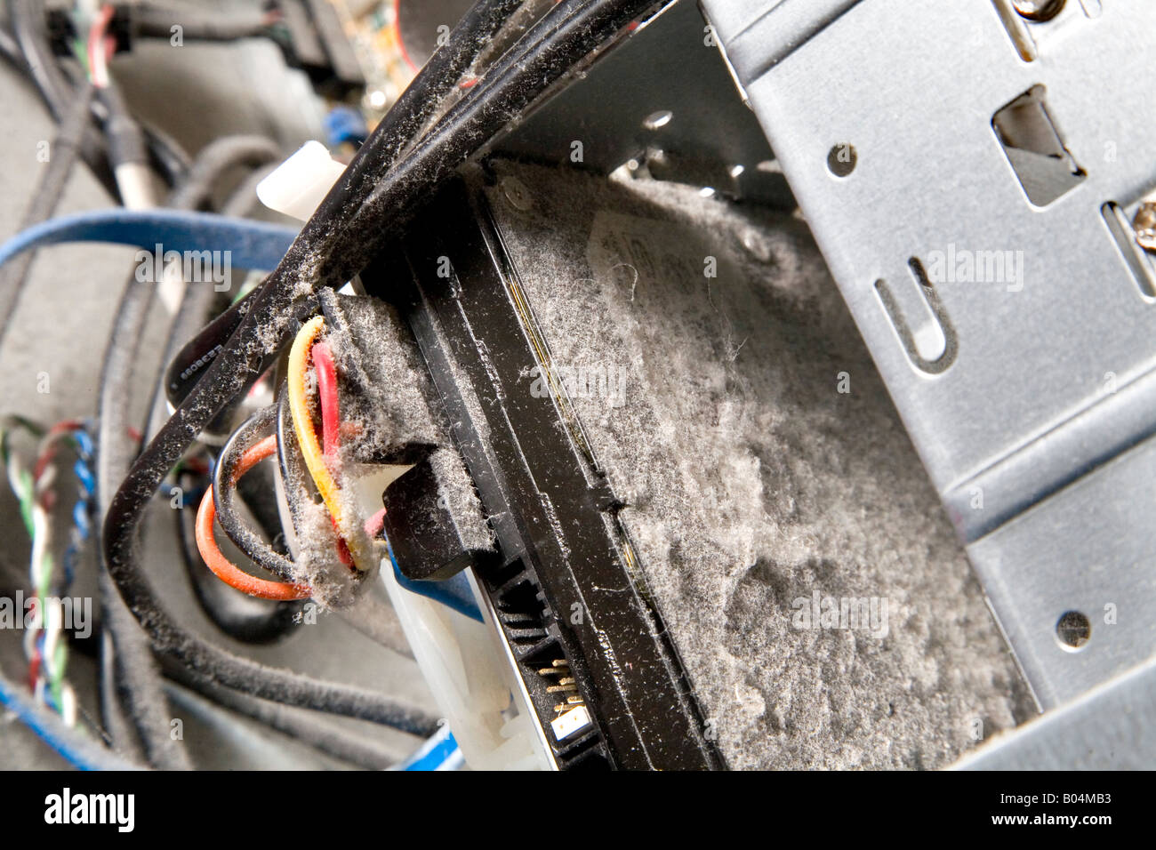 Inside a computer showing dust built up on the hard drive and cables ...