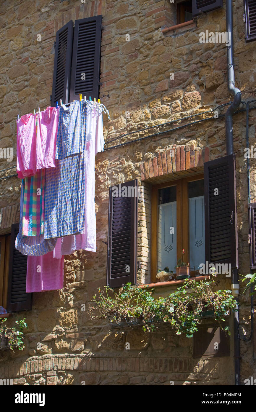 Clothes drying on a line outside stone buildings in the historic old ...
